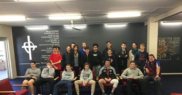 Milone speaks with studens | Wests Tigers